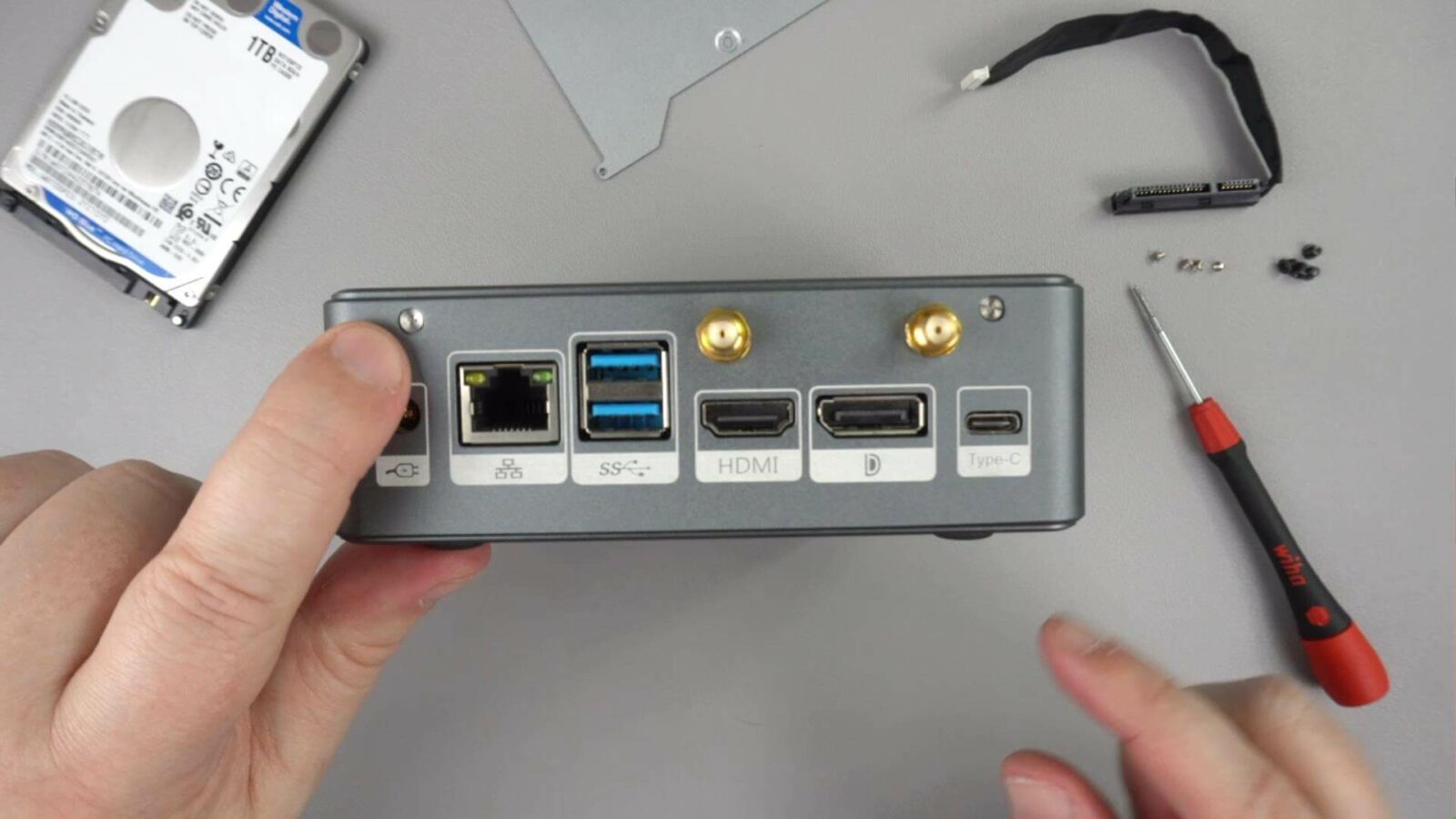 Remove the two screws located on the back on the DroiX Proteus 11.