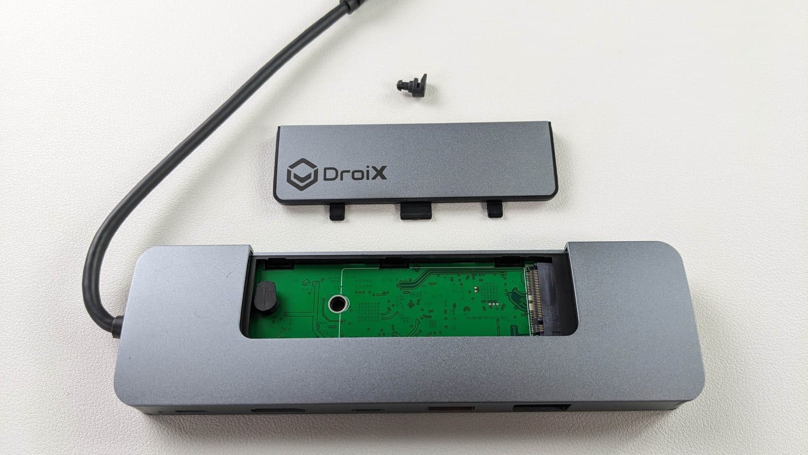 1. NH8 Hub 2. Open NVMe enclosure 3. Remove rubber screw 4. Insert NVMe 5. Screw NVMe into NH8 6 ...