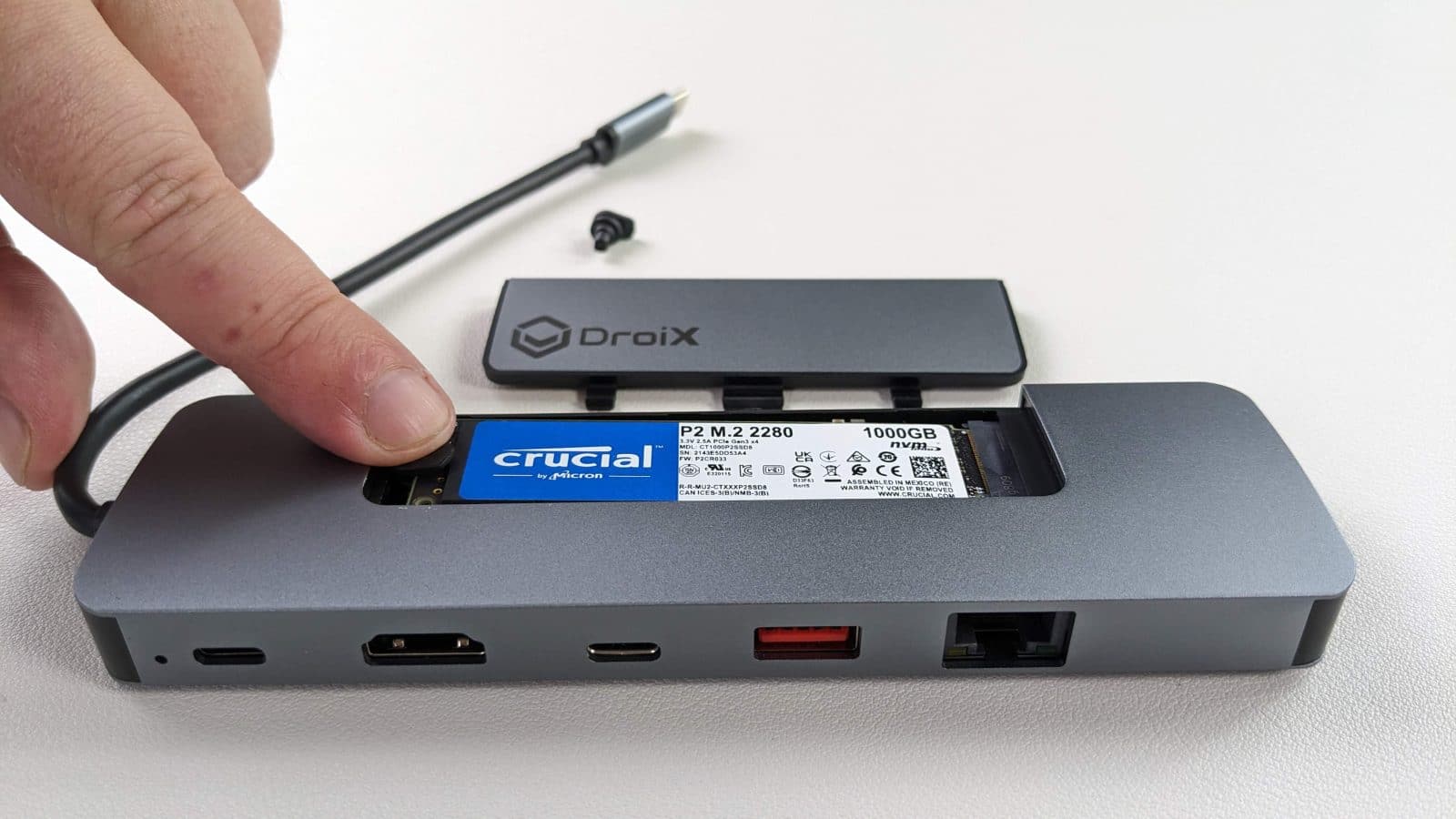 1. NH8 Hub 2. Open NVMe enclosure 3. Remove rubber screw 4. Insert NVMe 5. Screw NVMe into NH8 6 ...