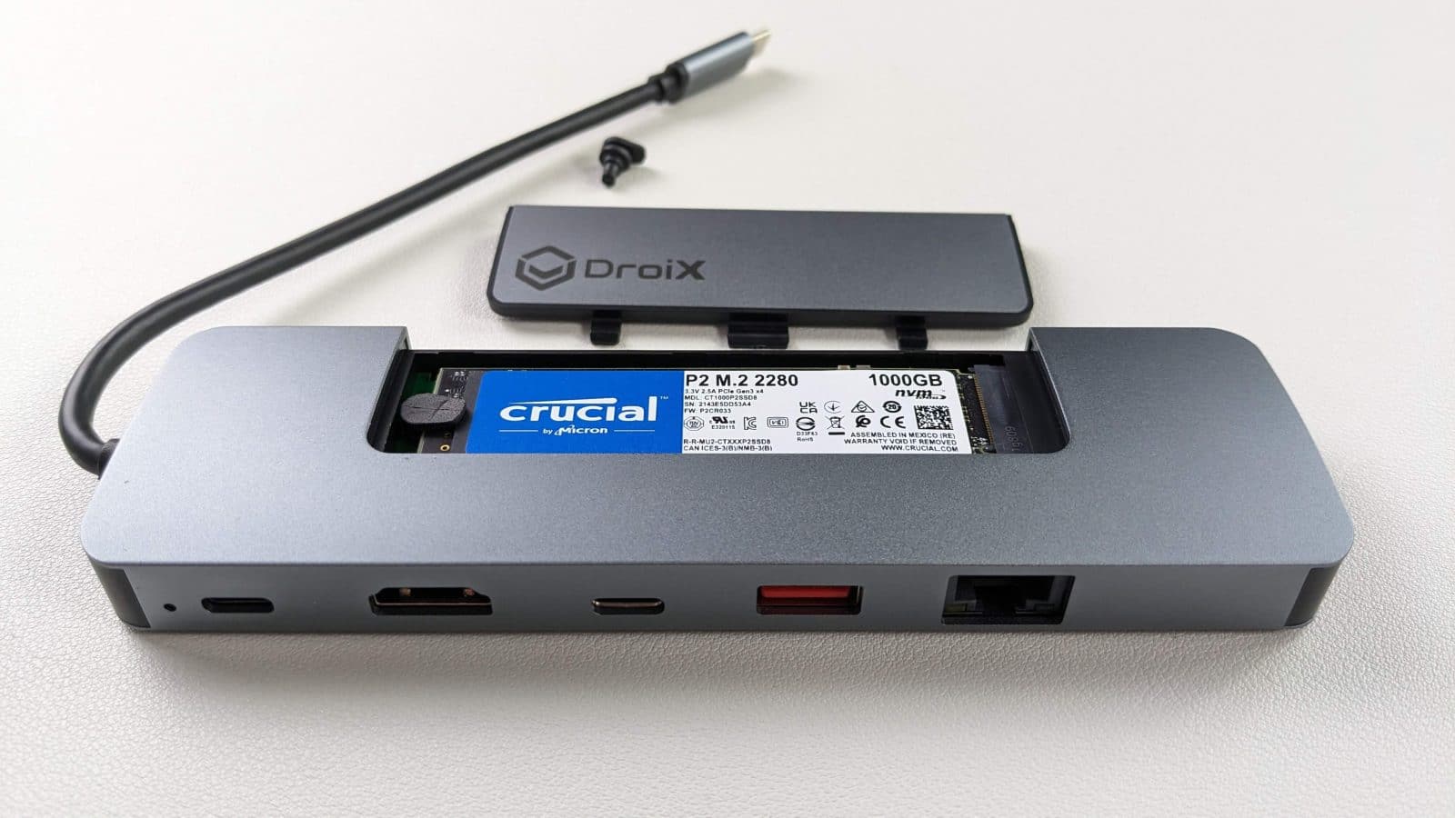 1. NH8 Hub 2. Open NVMe enclosure 3. Remove rubber screw 4. Insert NVMe 5. Screw NVMe into NH8 6 ...