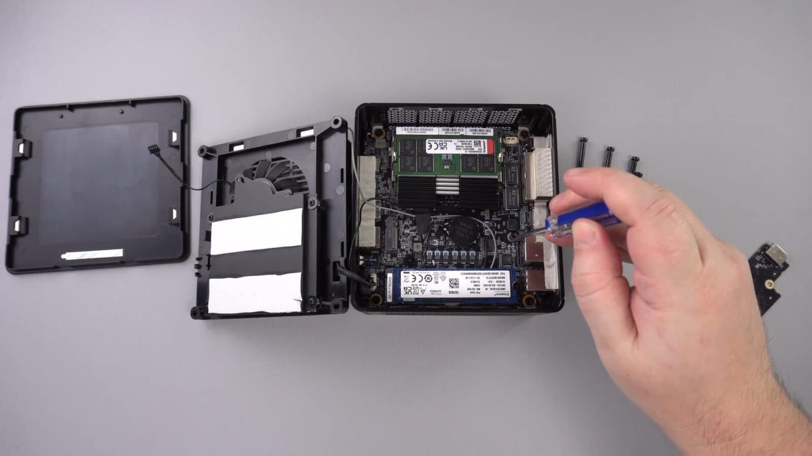 Unscrew the screw indicated below, this screw will keep the PCIe to ...